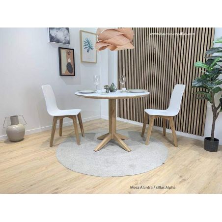 Petite table ronde avec pied central en bois et plateau blanc anthracite.